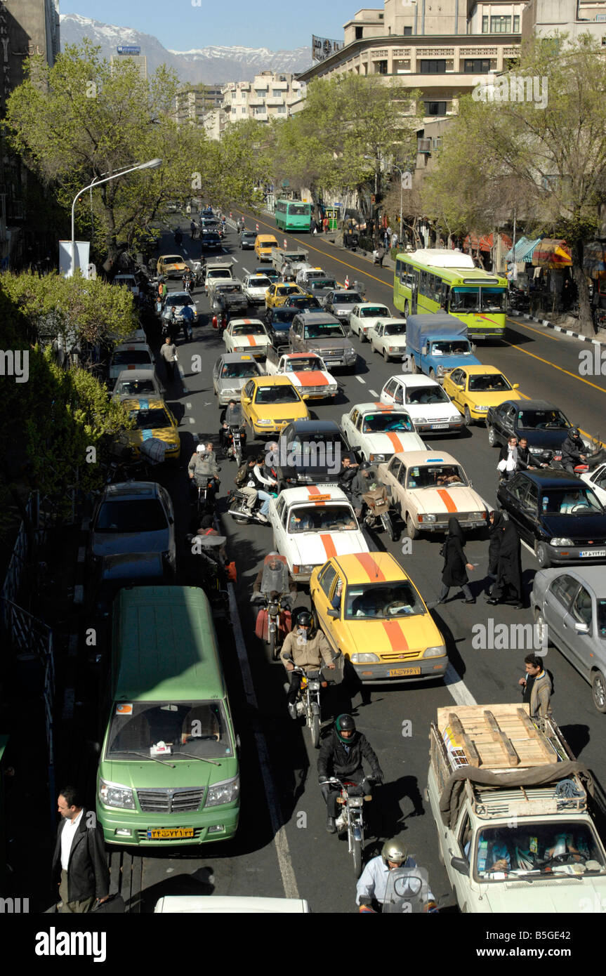 view of busy traffic scene looking North to Alborz Mountains, Tehran ...