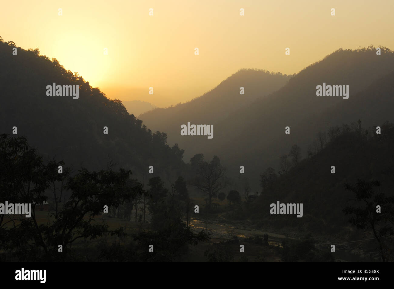 Sunset in western Nepal over a valley Stock Photo - Alamy