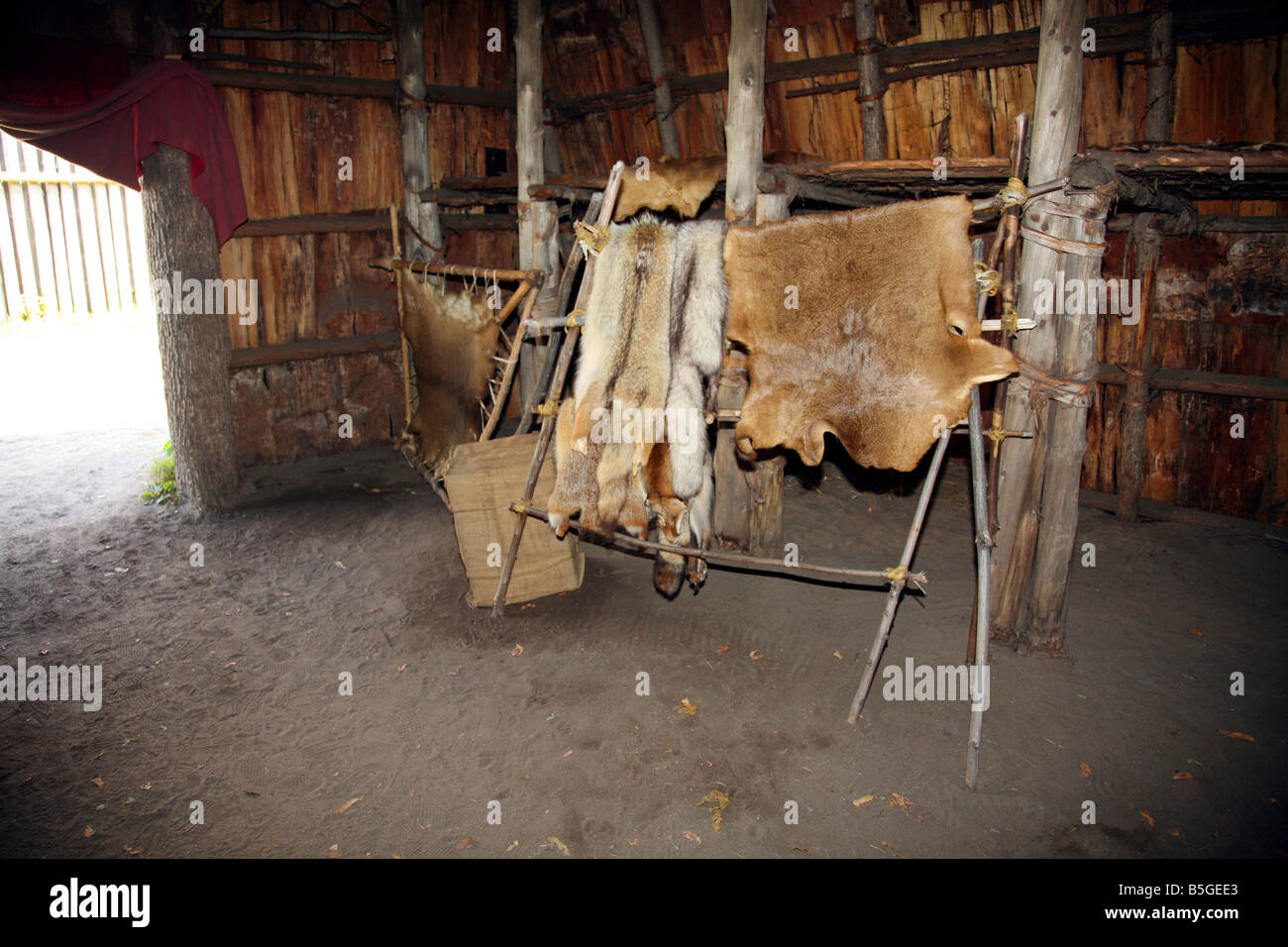 Furs are hung-up for drying in long-house at Aboriginal Village of the ...