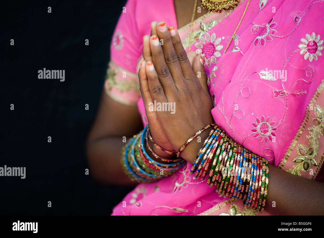 Indian girl wearing pink sari with prayer hands. India Stock Photo - Alamy