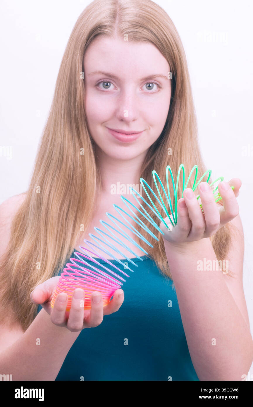 Teenage girl with slinky Stock Photo - Alamy