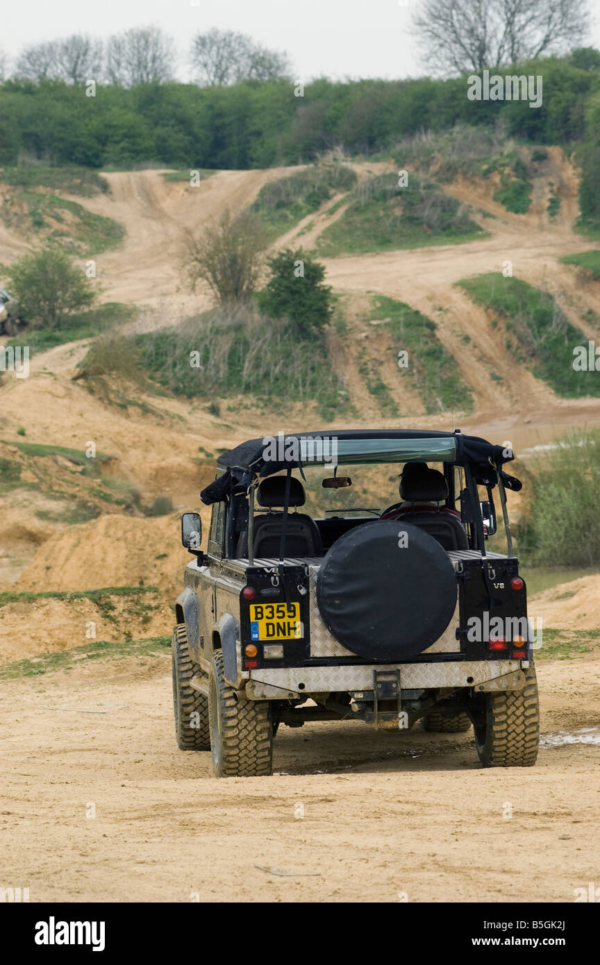 Rear view of a Land Rover defender driving off road in the UK Stock ...