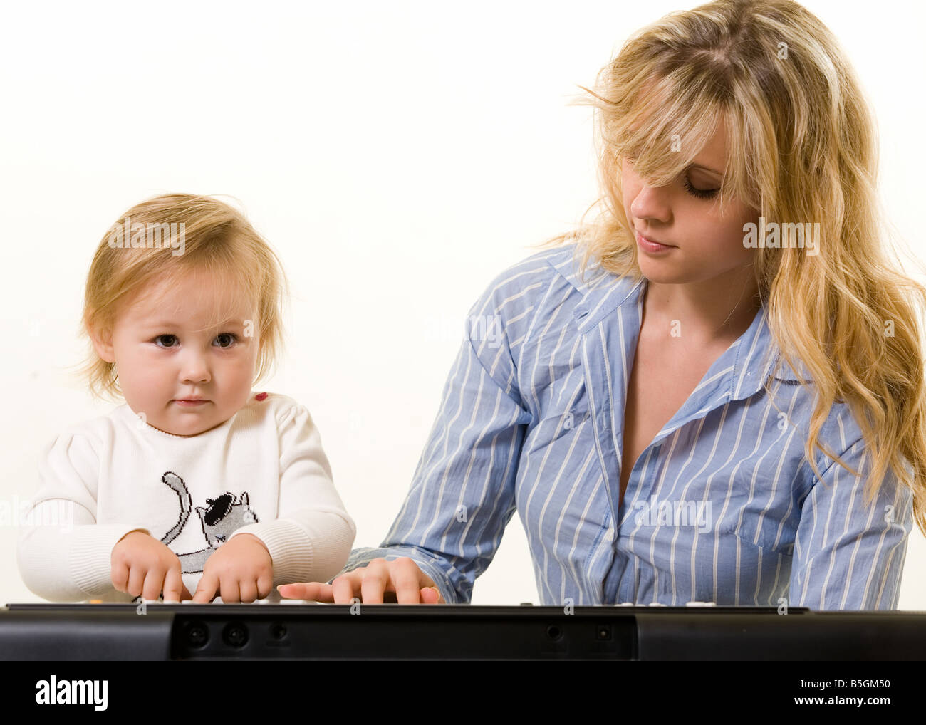 Mother teaching baby Stock Photo - Alamy