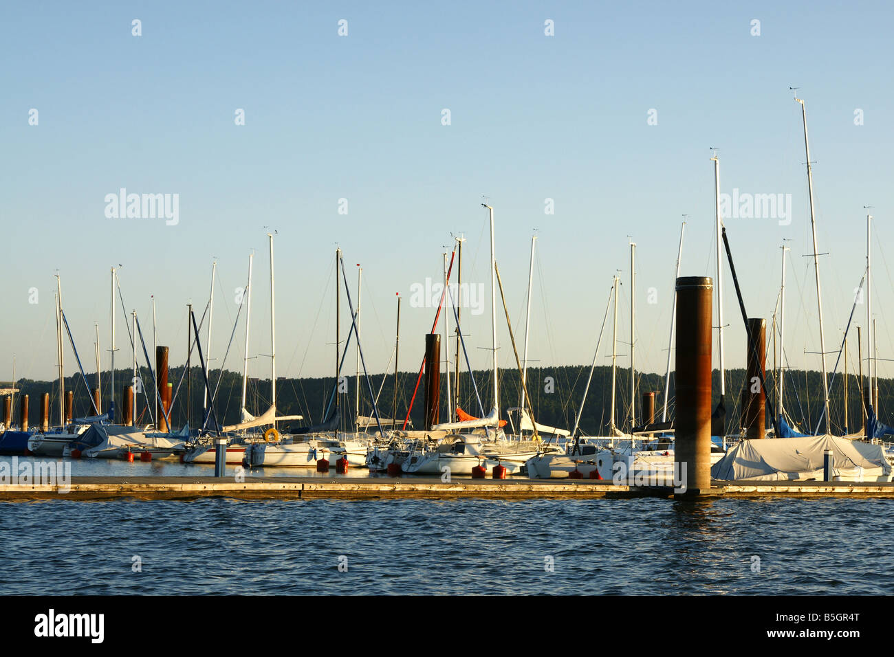sailing boats at jetty Stock Photo - Alamy