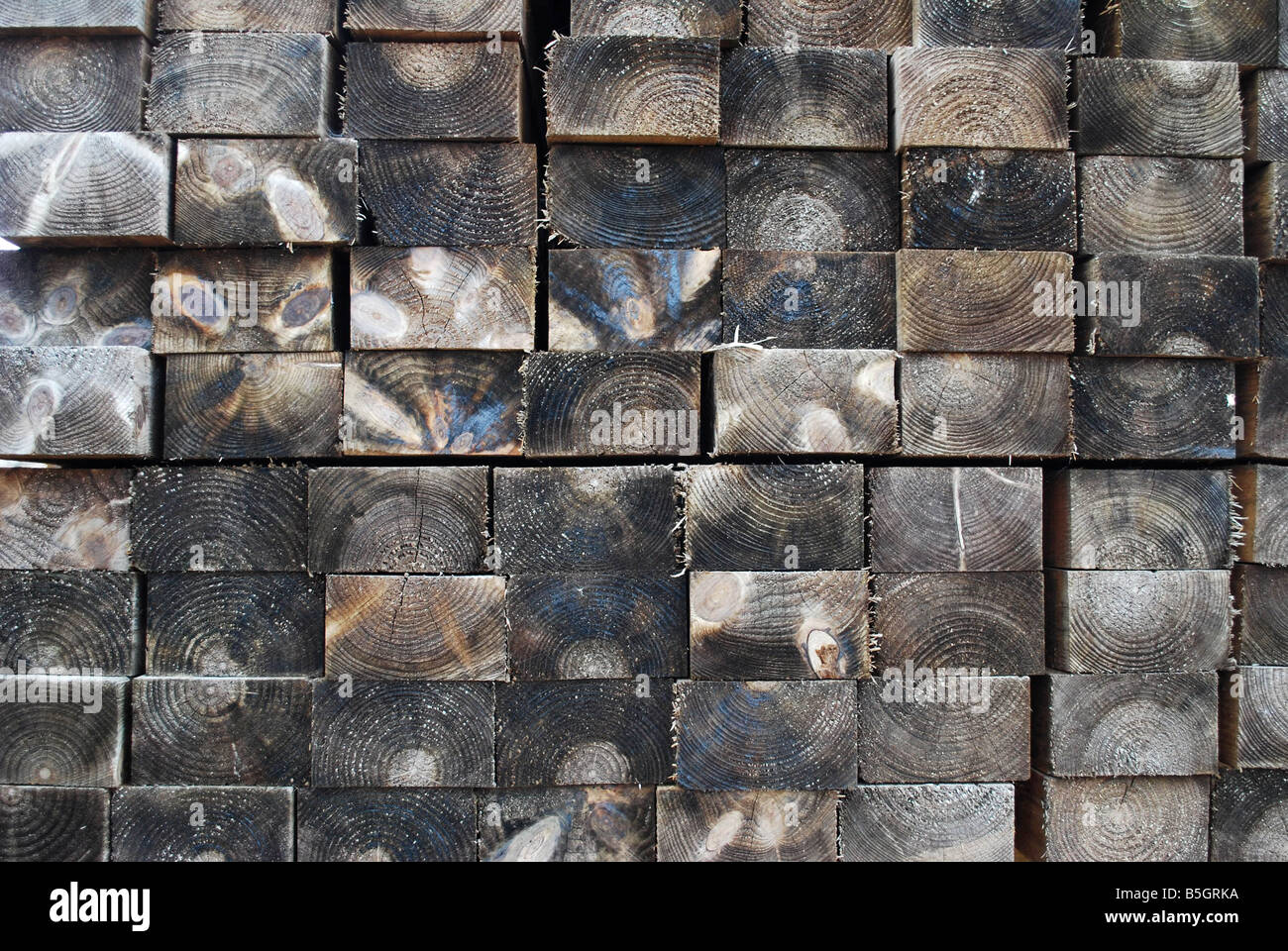 Stack of wood at a woodyard Stock Photo - Alamy