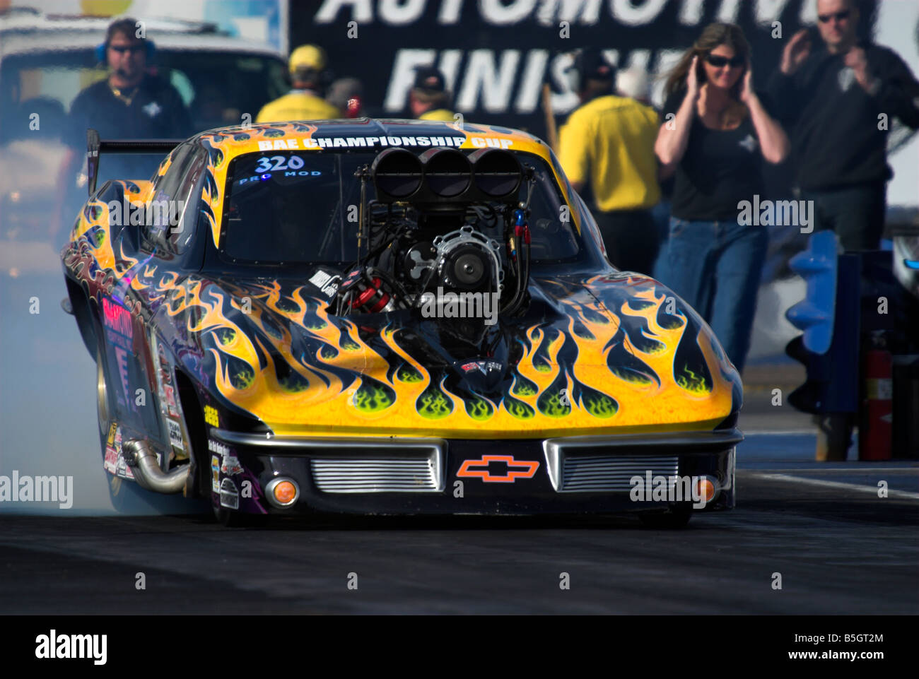 A Corvette dragster in the BAE Championship Cup Series takes off from ...