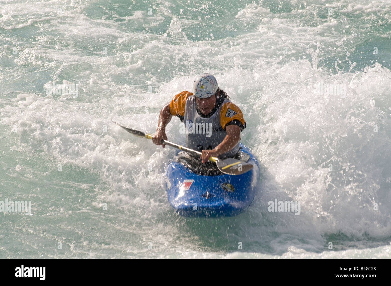 Competitor in whitewater kayaking competition Stock Photo - Alamy