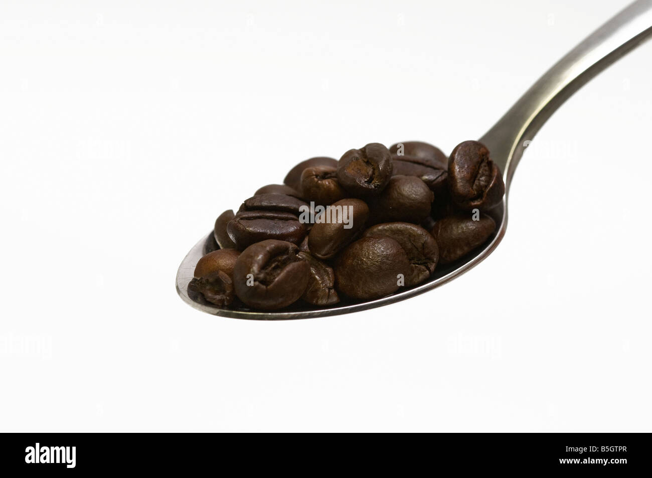 a spoon with coffee grains Stock Photo - Alamy