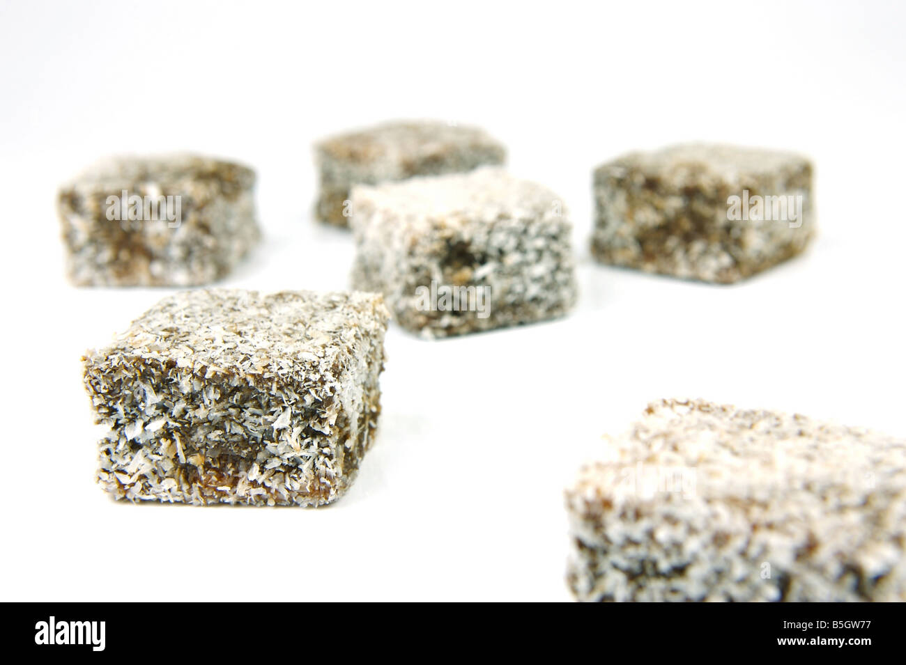 Lamingtons isolated against a white background Stock Photo - Alamy