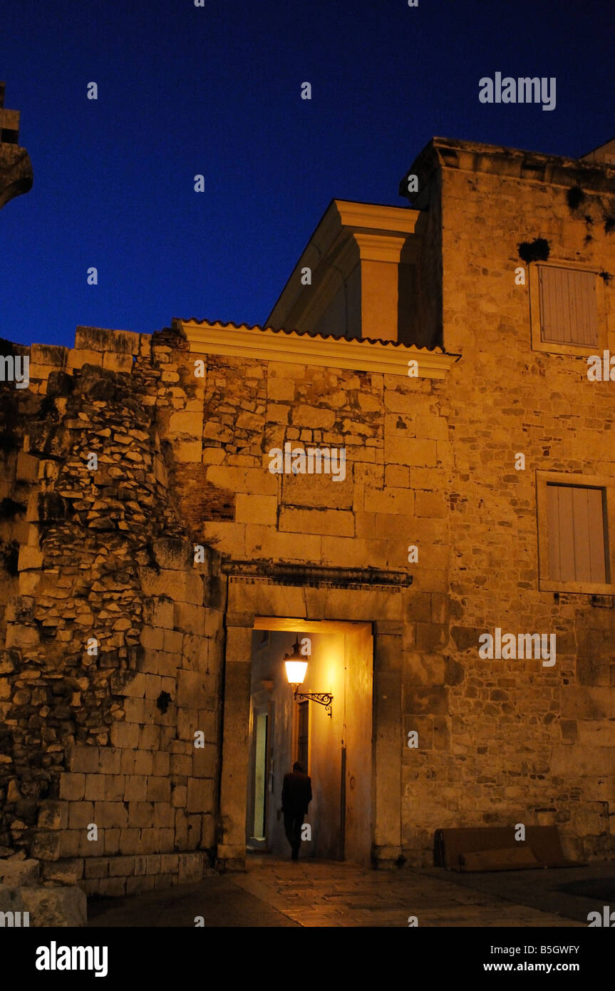 Person walking through a gate in the Walls of the Diocletian Palace ...