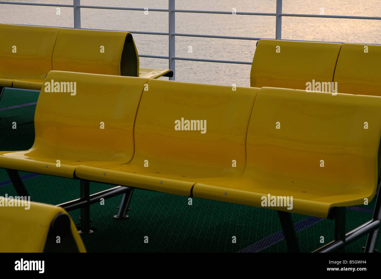 Yellow benchs on a ferry Stock Photo - Alamy
