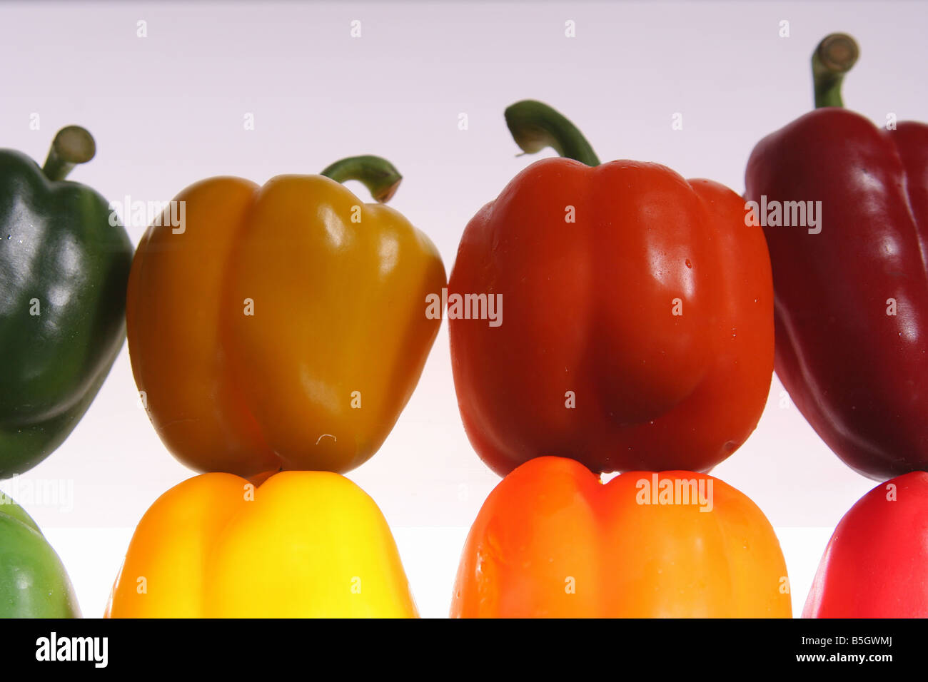 Reflections of various colored capsicum (bell peppers Stock Photo - Alamy