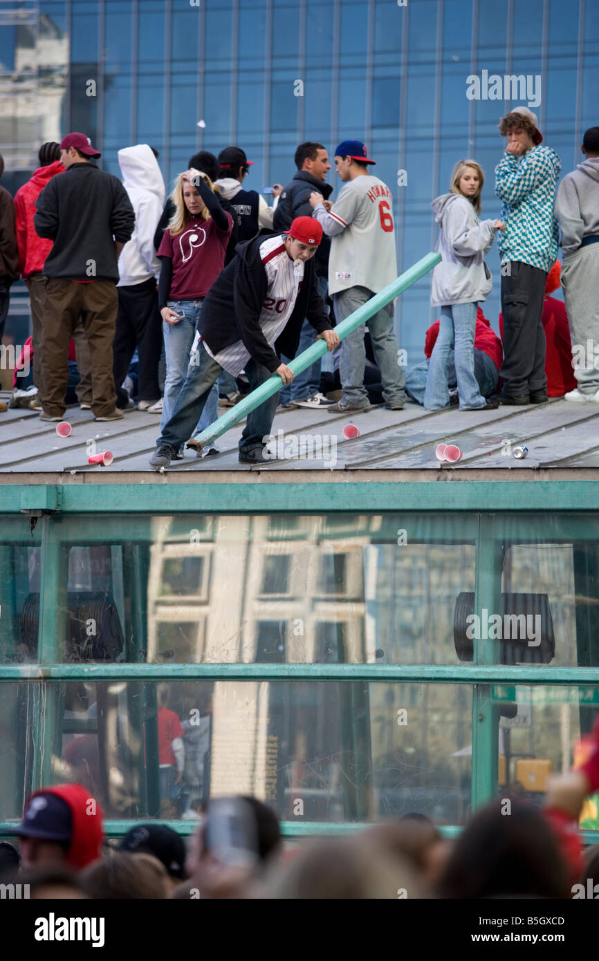 Crowd climbing on subway station building Stock Photo - Alamy
