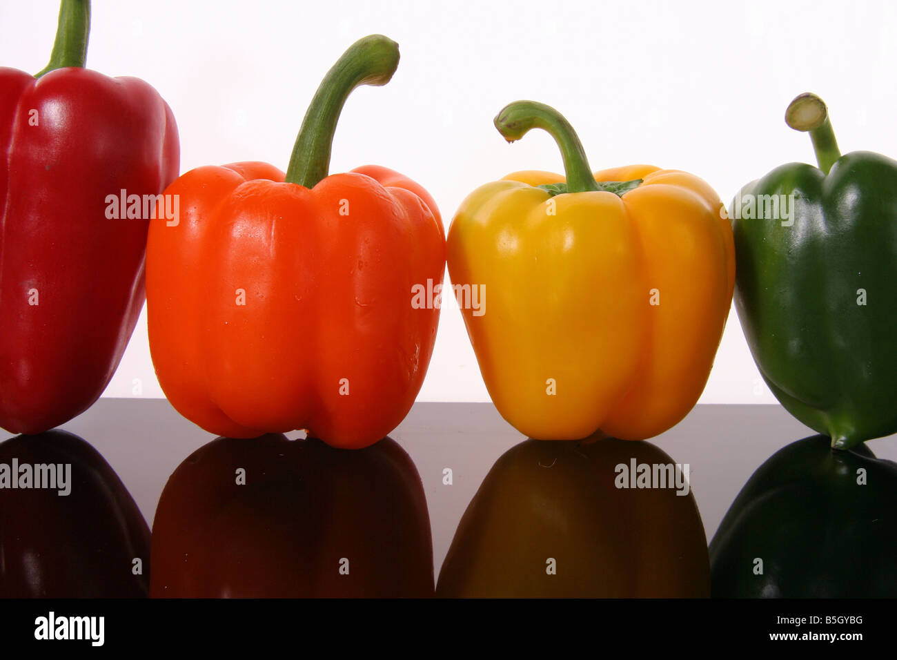 Various colored capsicum (bell peppers) close up Stock Photo - Alamy