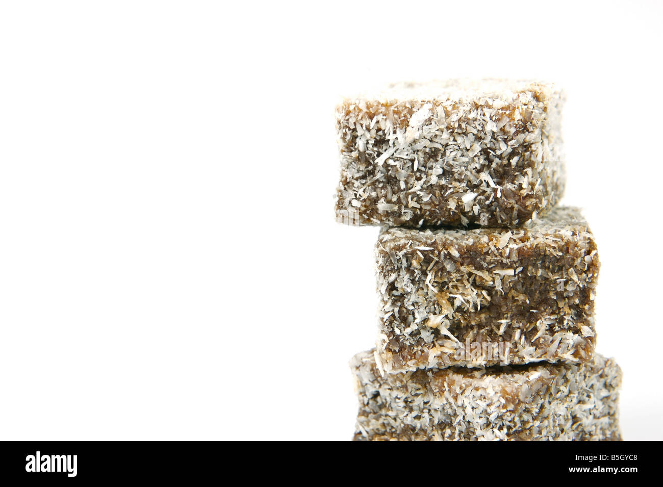Lamingtons isolated against a white background Stock Photo - Alamy