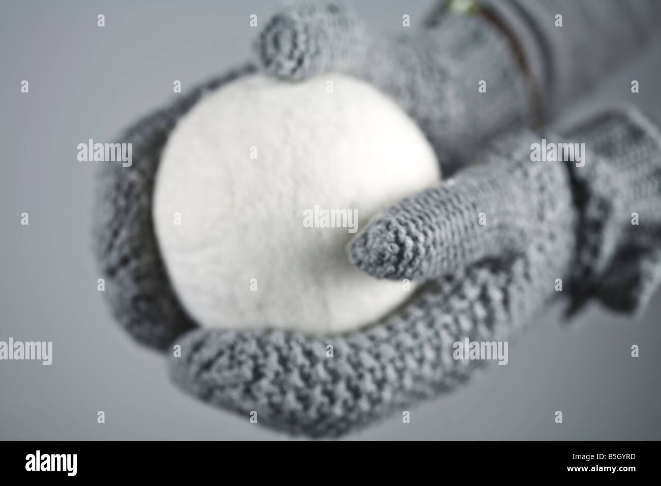 Snowball in hands Stock Photo - Alamy