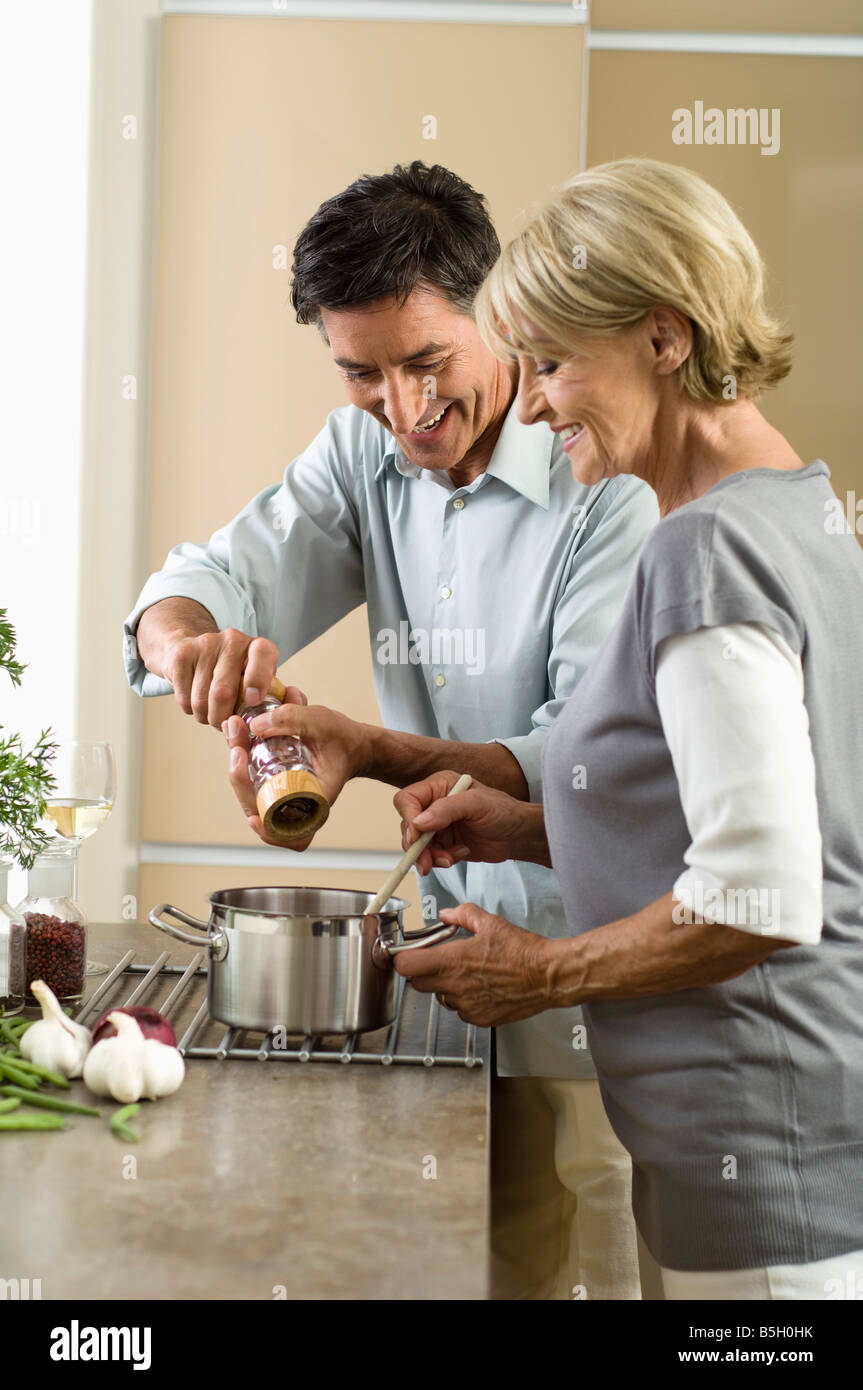 Couple cooking together Stock Photo - Alamy