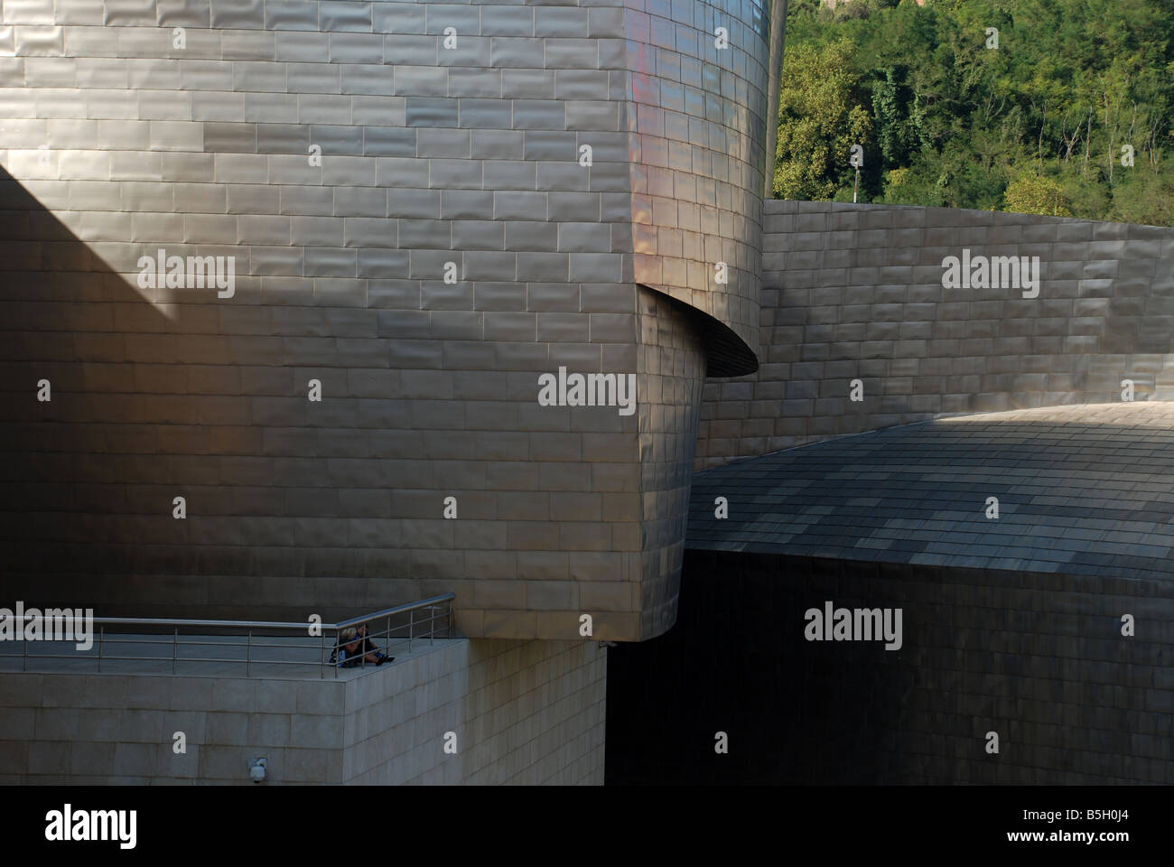 Guggenheim close up, back view, with couple sitting, Bibao, Spain Stock ...