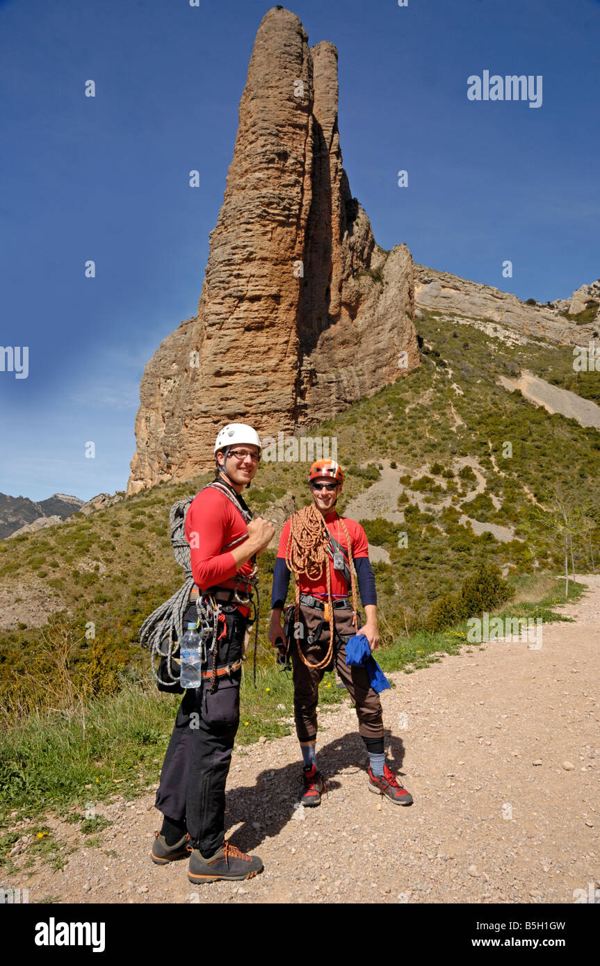 Two rock climbers ready to climb sandstone rock Stock Photo - Alamy