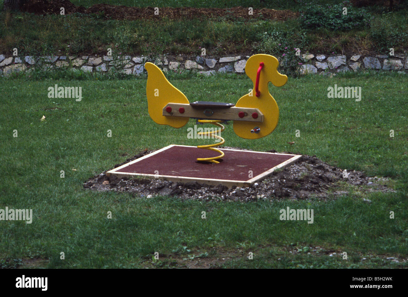 Wooden duck at playground Stock Photo - Alamy