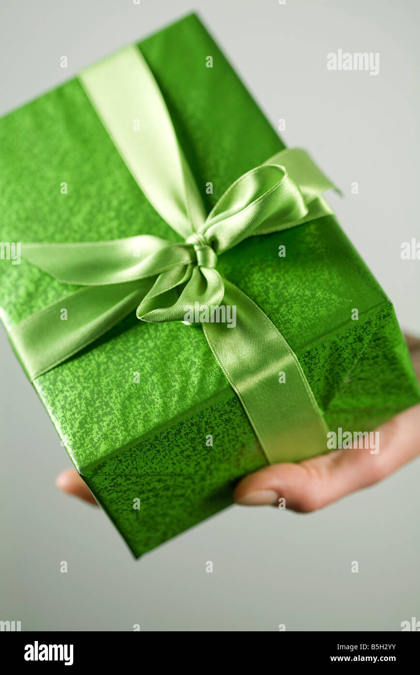 green paper wrapped present gift Stock Photo - Alamy