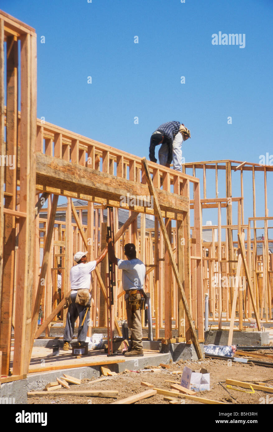 Homes being built in framing stage of construction Stock Photo - Alamy