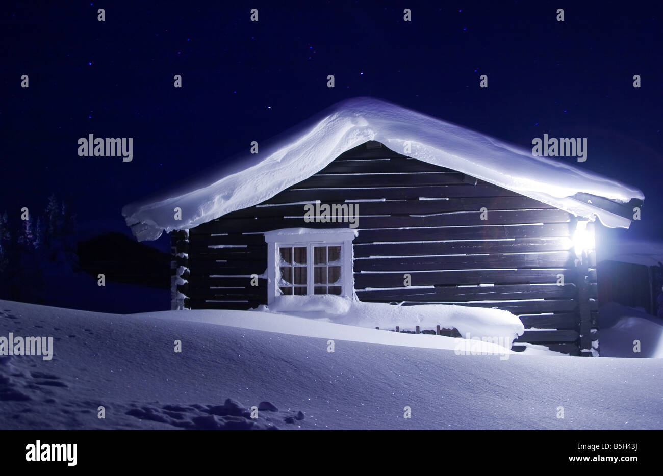 a log house at night in norway Stock Photo - Alamy