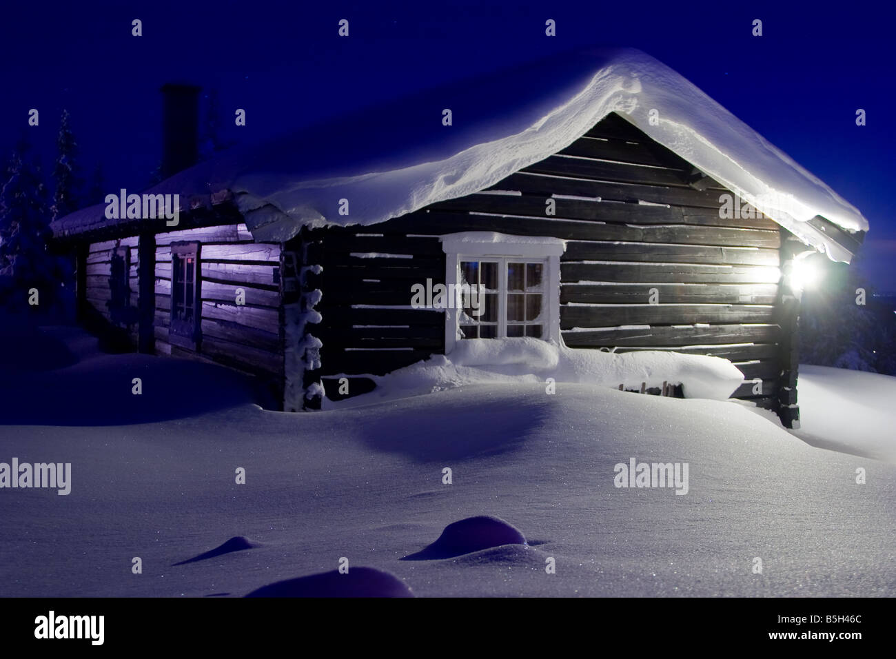 a log house at night in norway in snowy winter Stock Photo - Alamy
