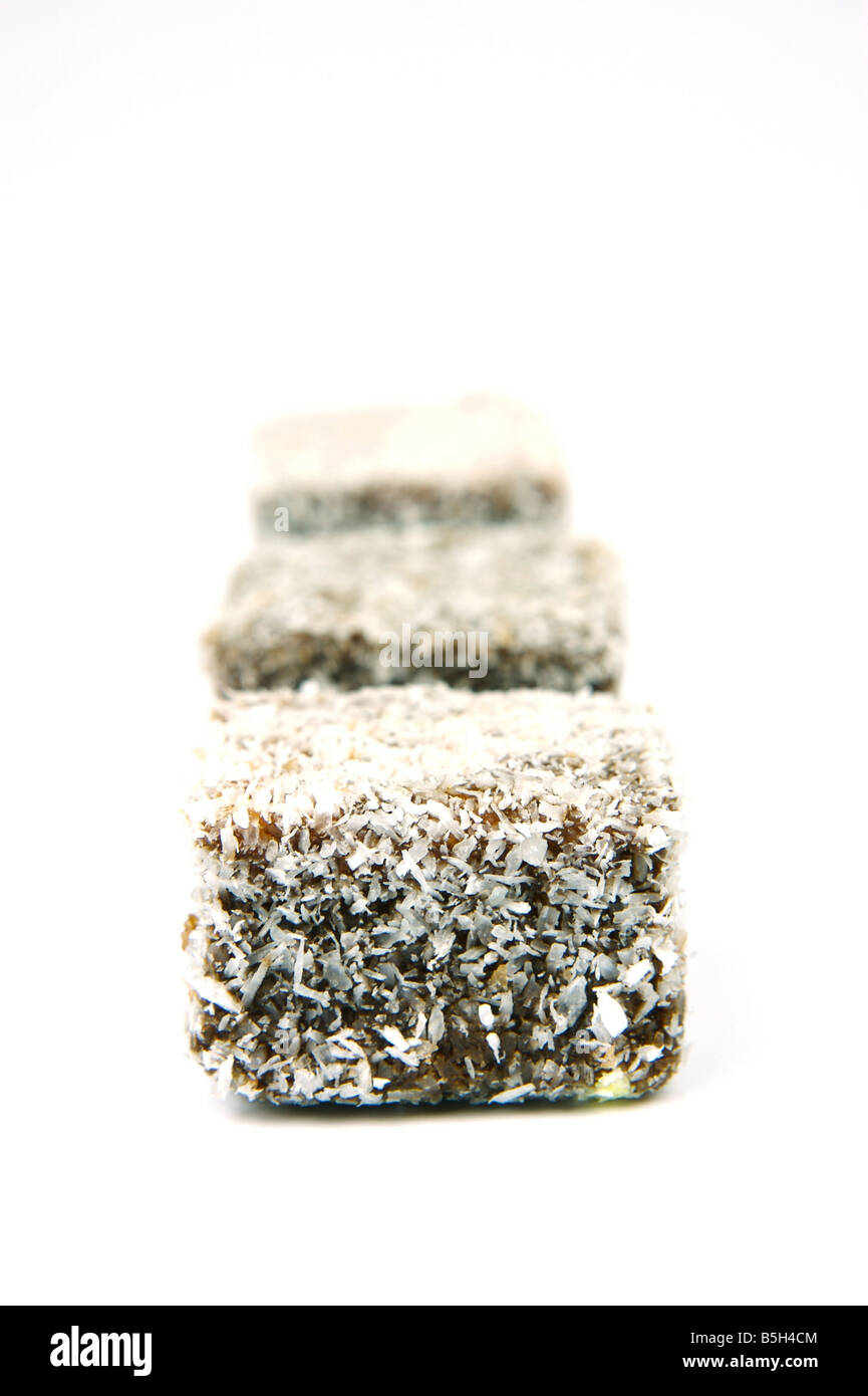 Lamingtons isolated against a white background Stock Photo - Alamy