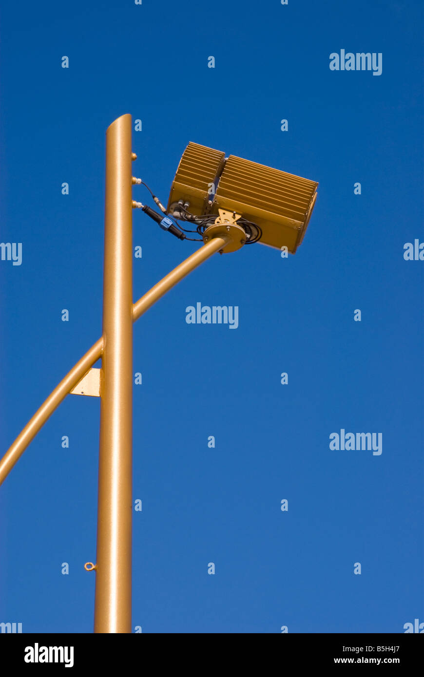cctv camera on post high up against blue sky Stock Photo - Alamy