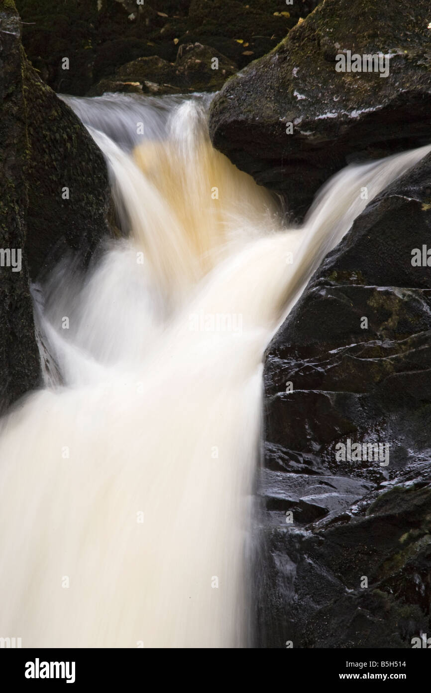 Water rushing rapidly from Ingleton Waterfall in North Yorkshire Stock ...