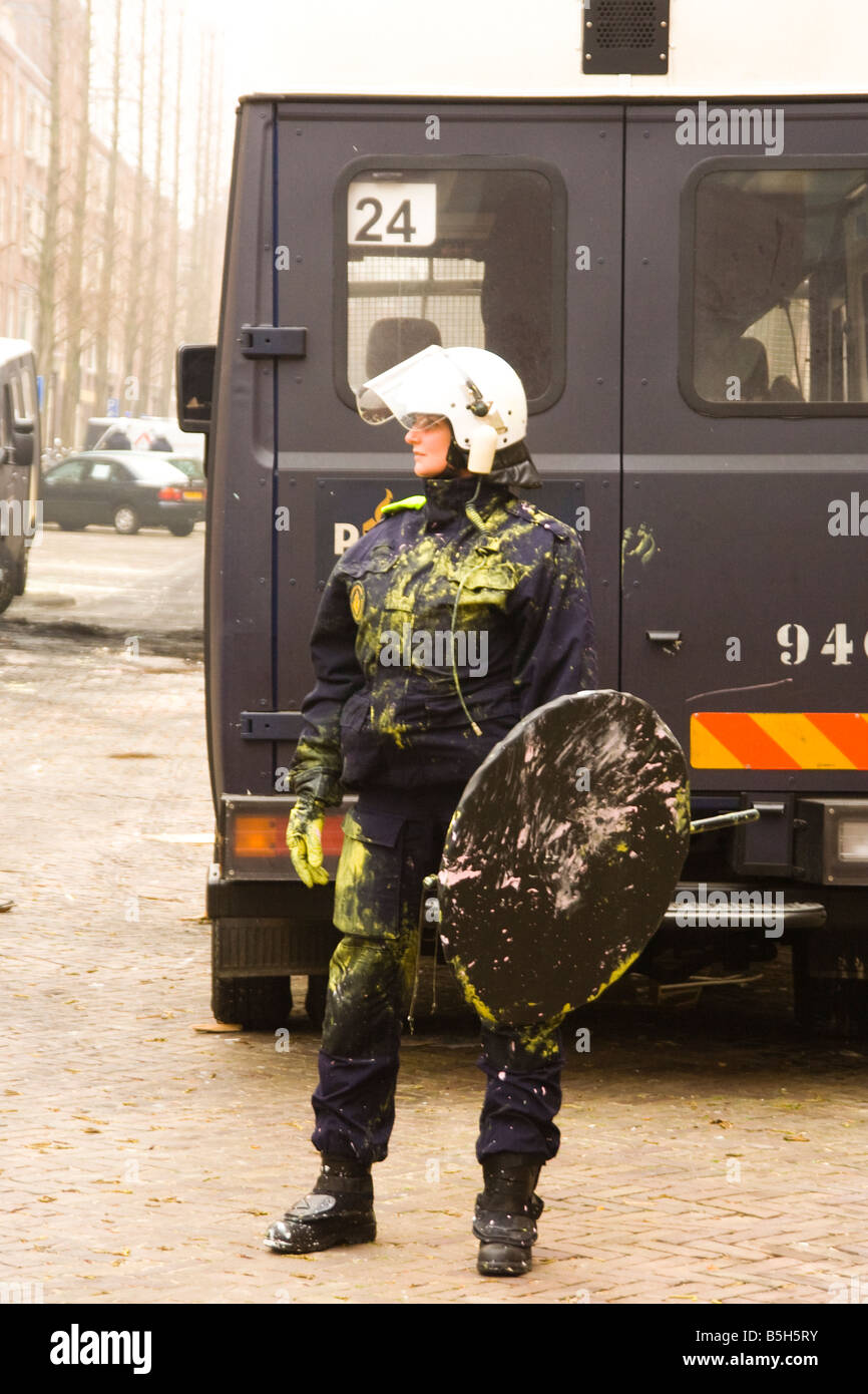 Dutch riot police covered in paint Stock Photo - Alamy