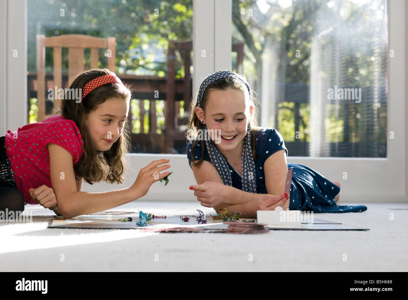 girls playing board games Stock Photo - Alamy