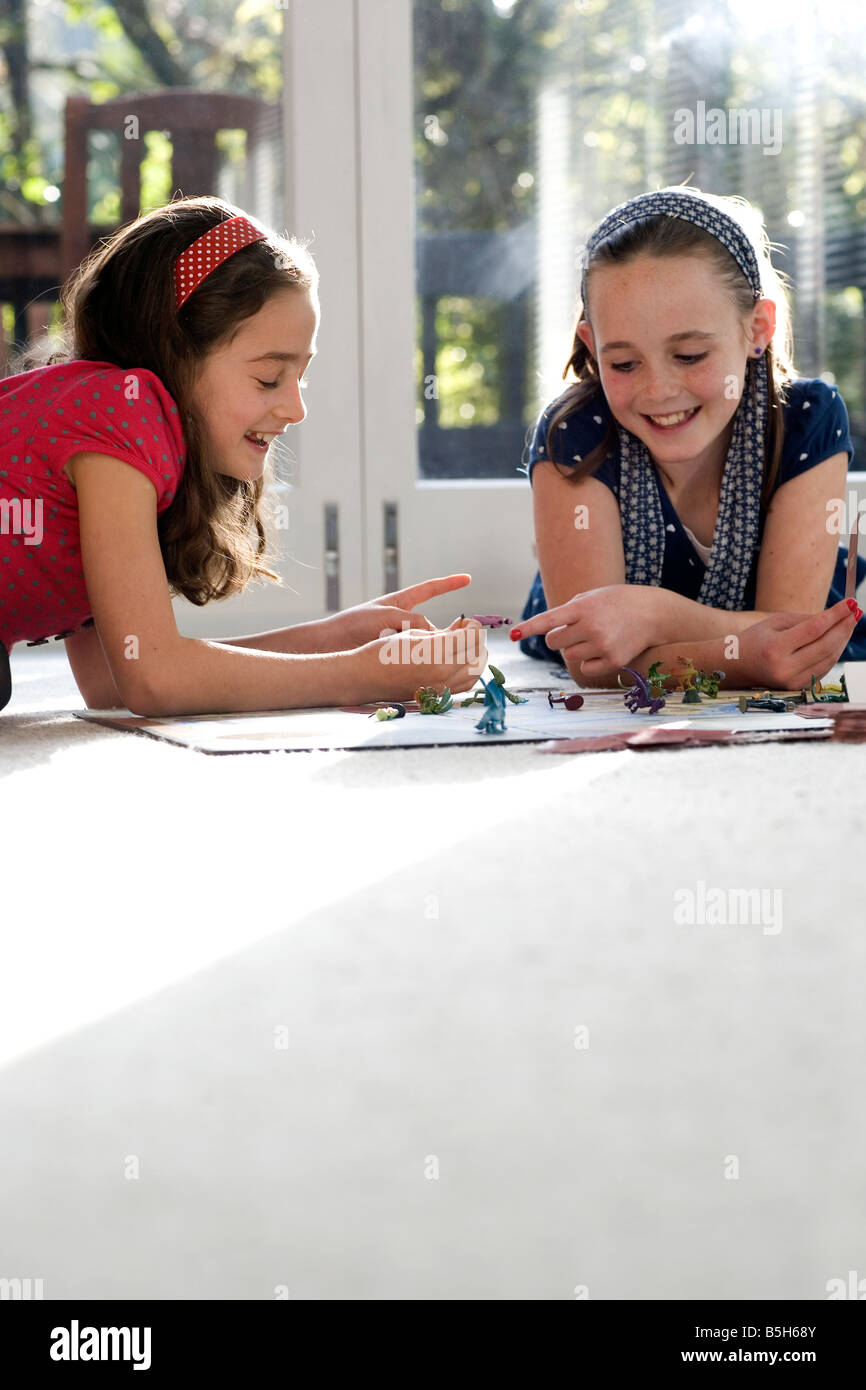 girls playing board games Stock Photo - Alamy