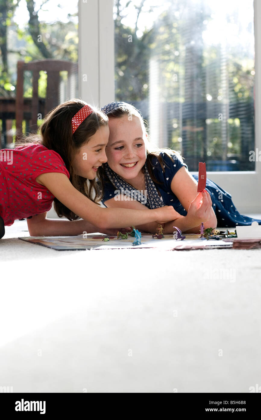 girls playing board games Stock Photo - Alamy