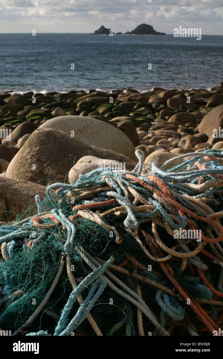 Old fishing net and rope washed up on Cornish beach Stock Photo - Alamy