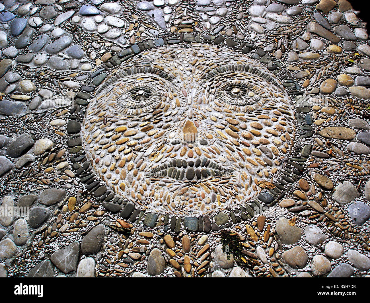 a stone paving pattern in the form of the sun Stock Photo - Alamy