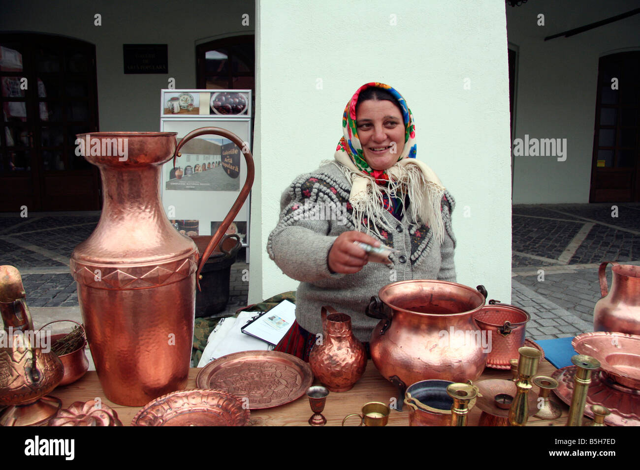 Romanian woman, traditional crafts market, copper ware stall, Sibiu ...