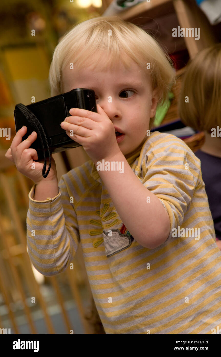 young boy child toddler in nursery day care centre toddler looking ...