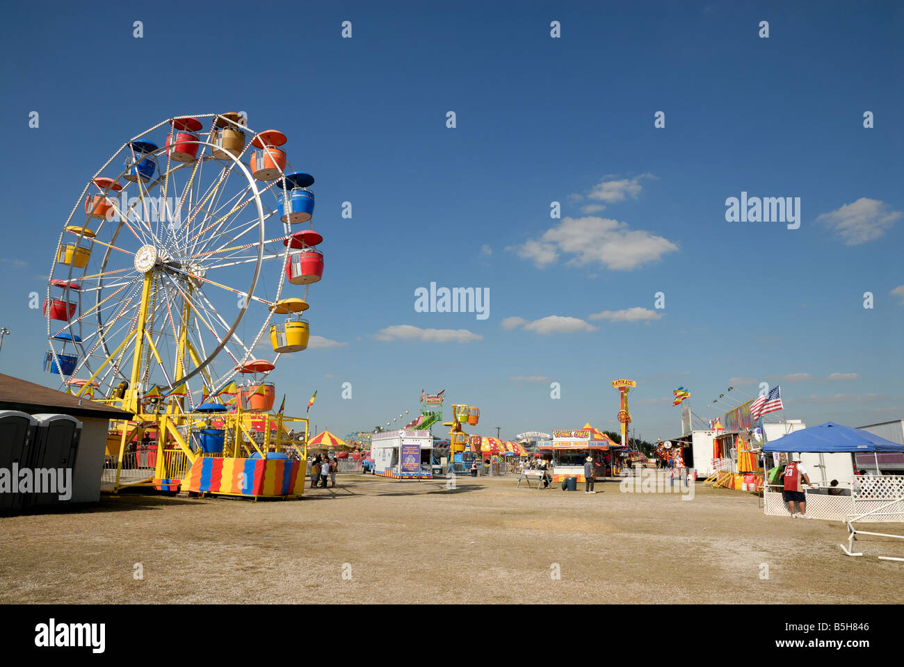 Amusement park with ferris wheel Stock Photo - Alamy