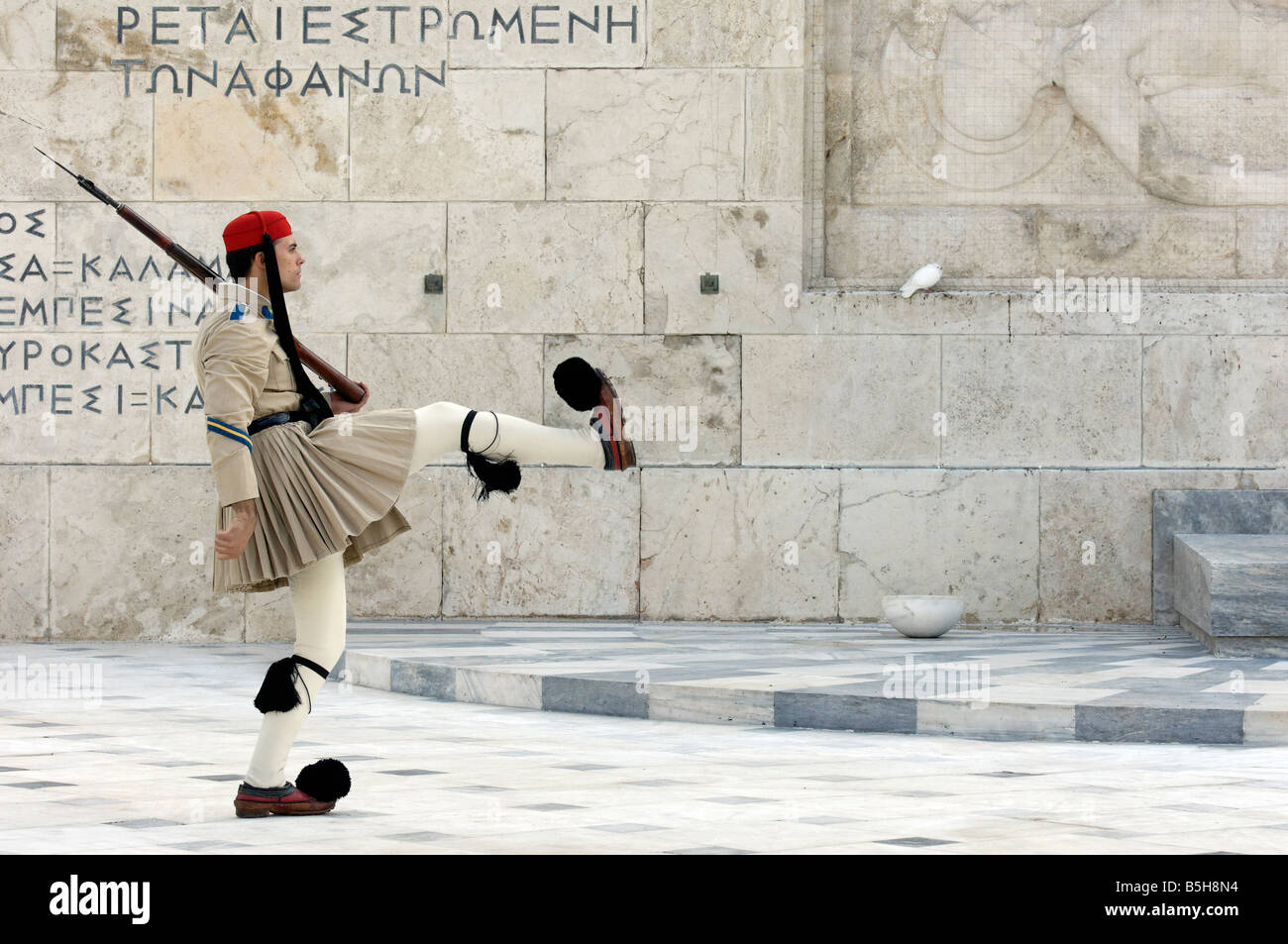 A traditionally dressed soldier, Evzone, changing the gaurd at the ...