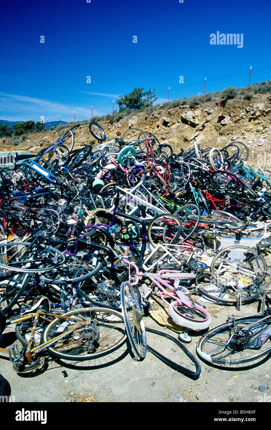 Discarded bicycles piled for recycling Stock Photo - Alamy