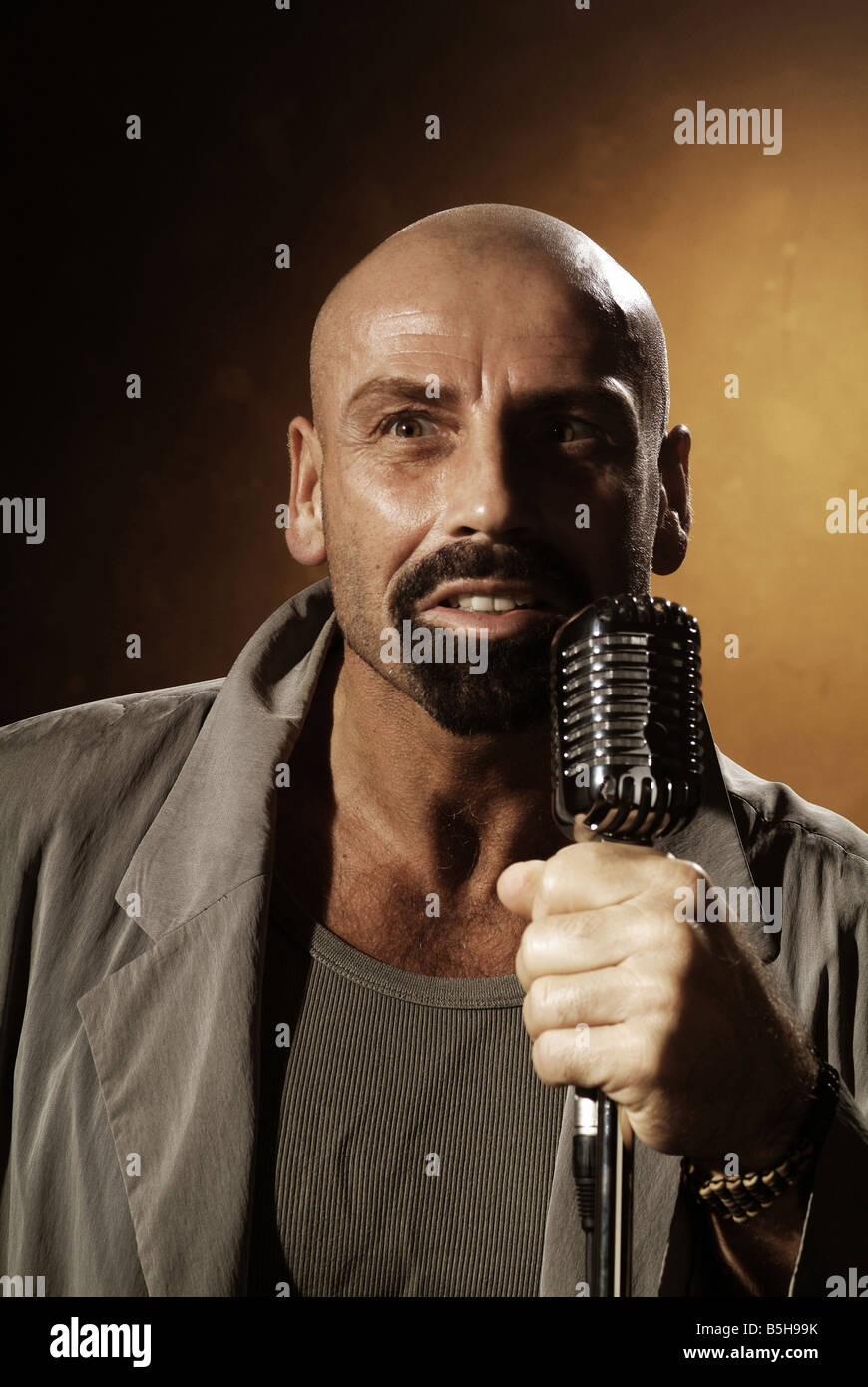 Man with a microphone Stock Photo - Alamy