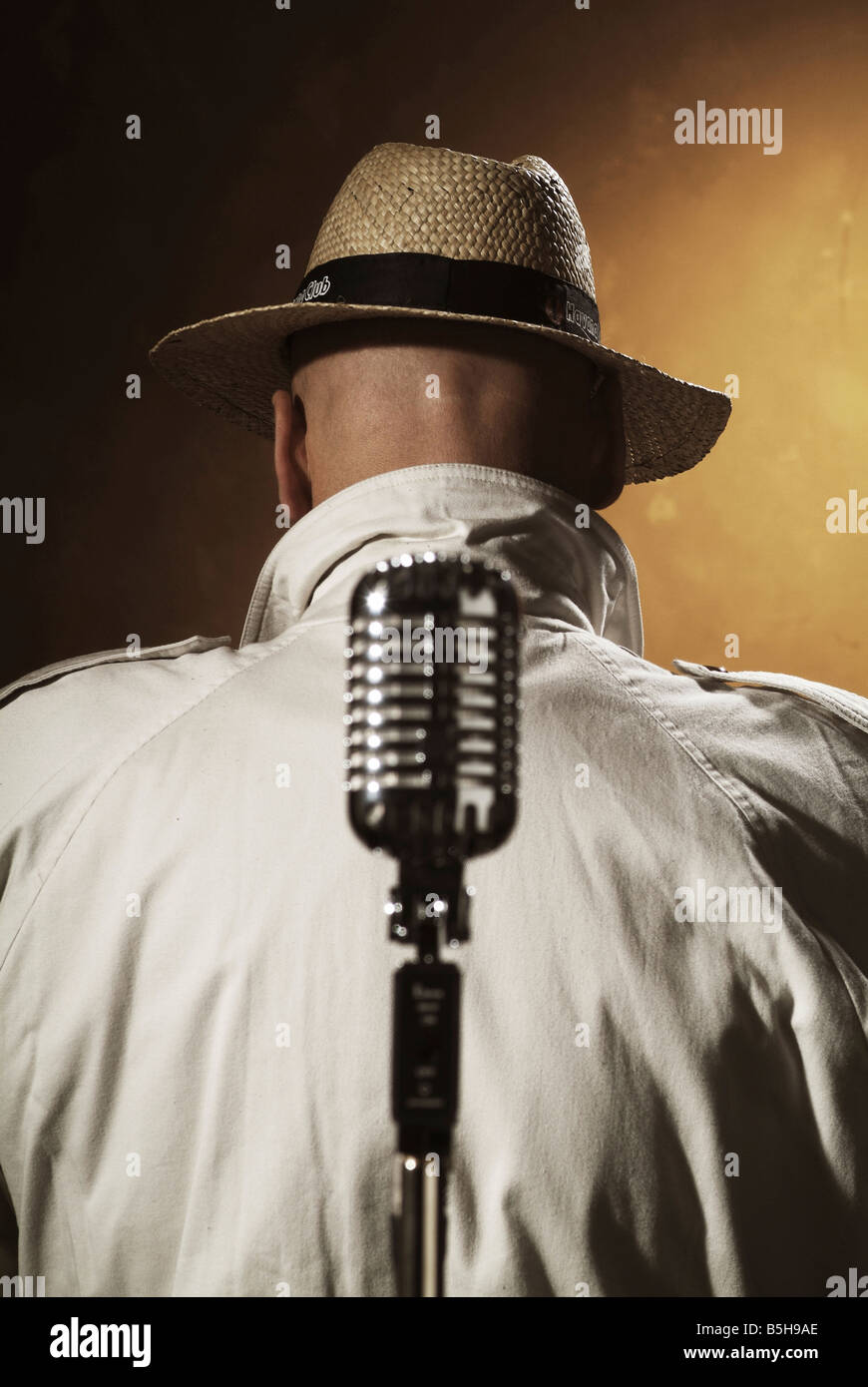 Man turning his back on a microphone Stock Photo - Alamy