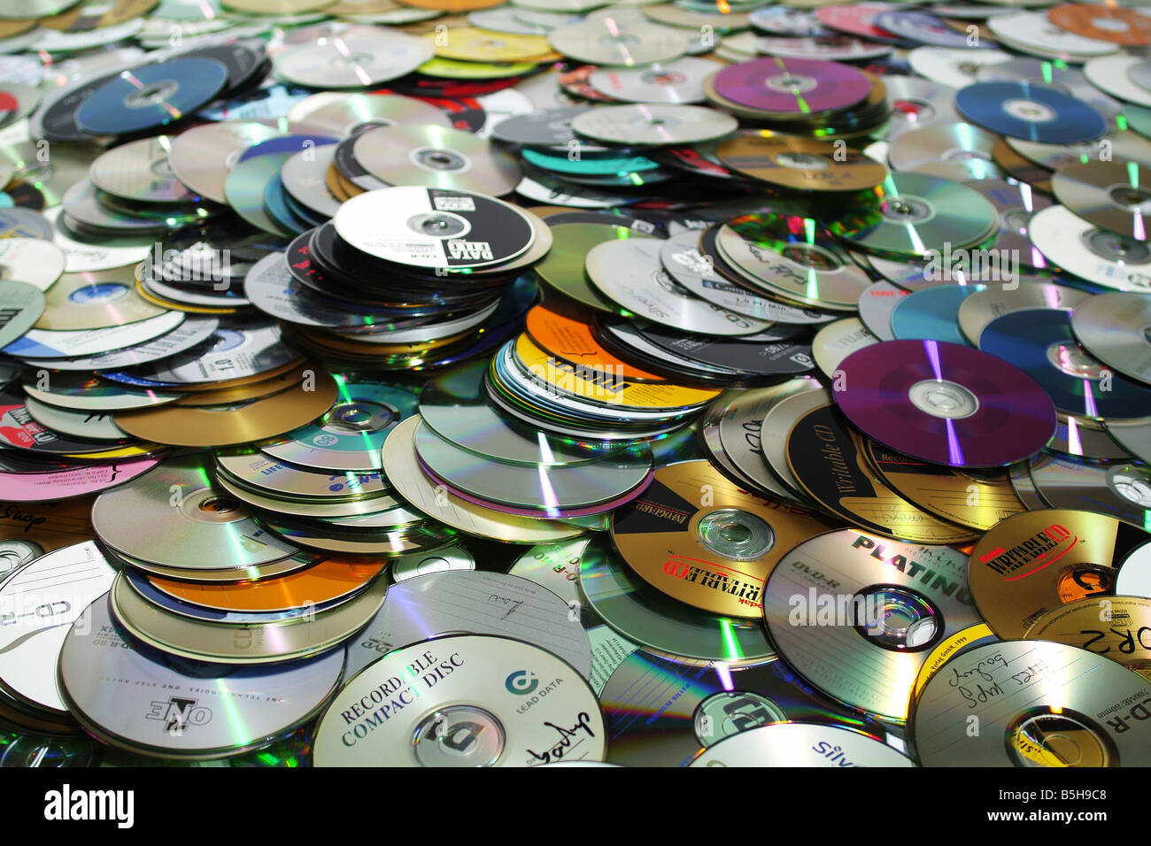 Heap of CDs and DVDs Stock Photo - Alamy