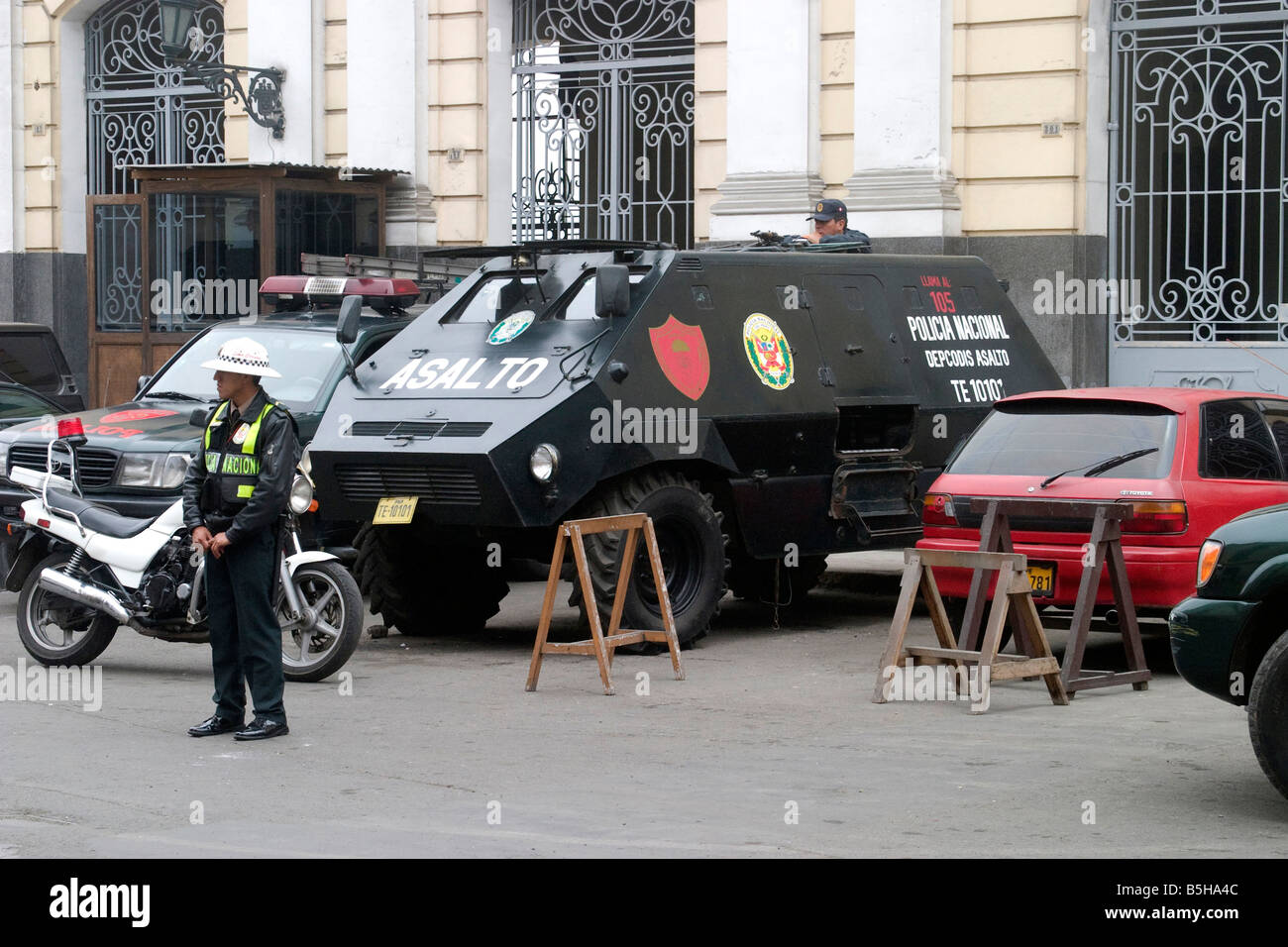 a policeman and an armored vehicle in Lima Peru Stock Photo - Alamy