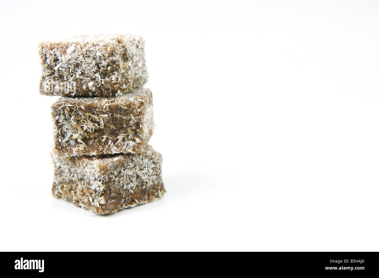 Lamingtons isolated against a white background Stock Photo - Alamy