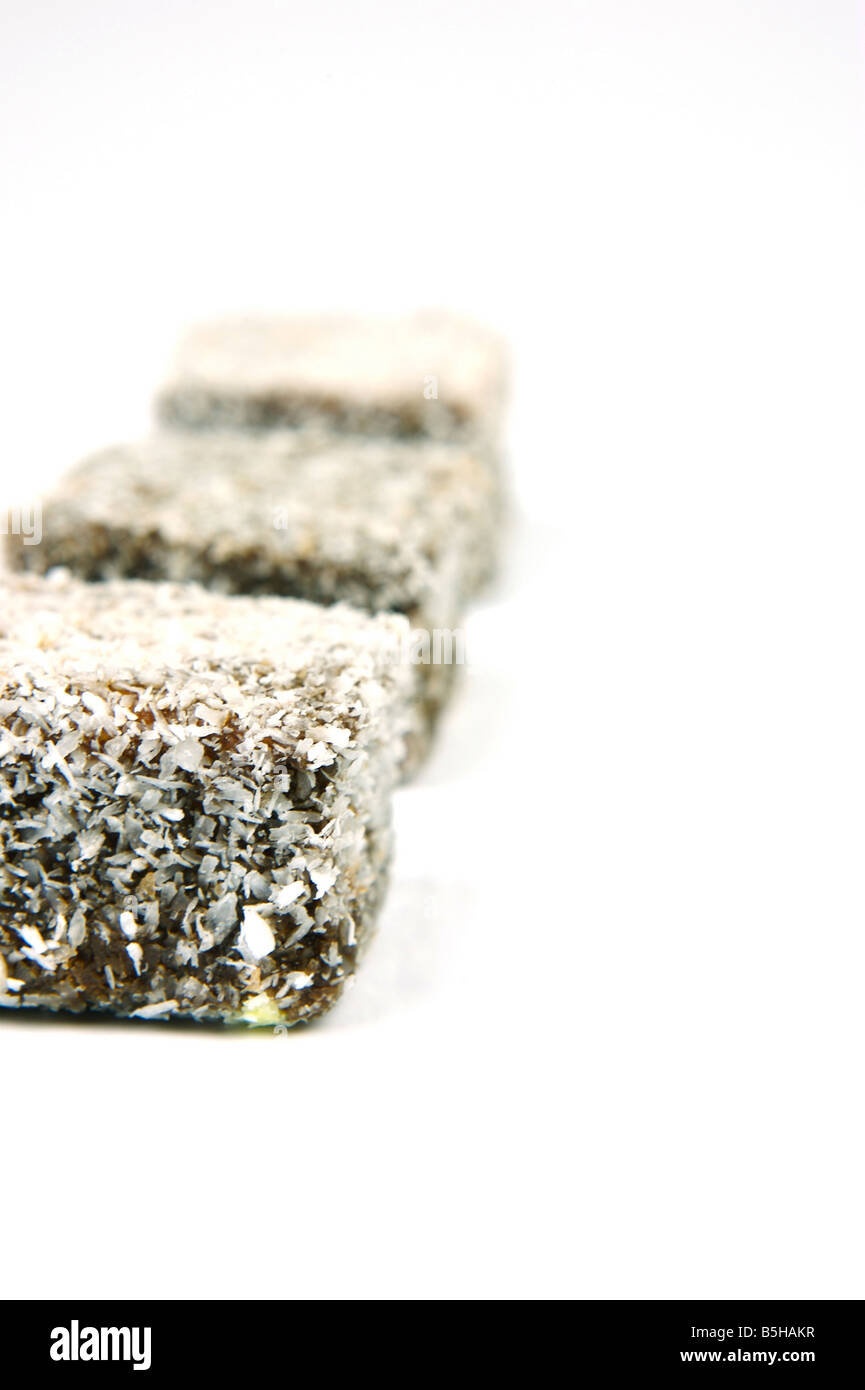 Lamingtons isolated against a white background Stock Photo - Alamy