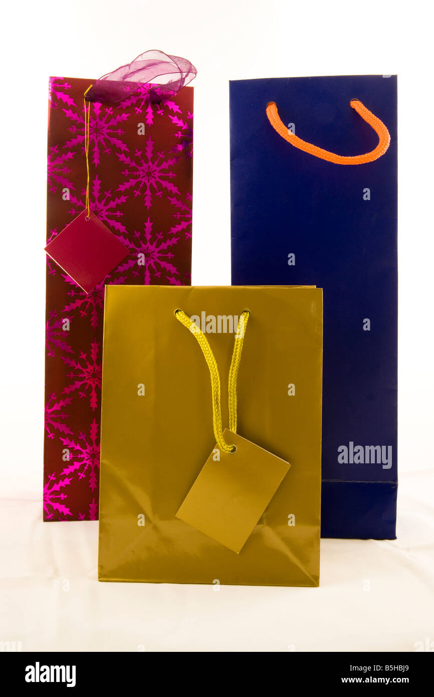 Three colourful gift bags isolated against white background Stock Photo ...