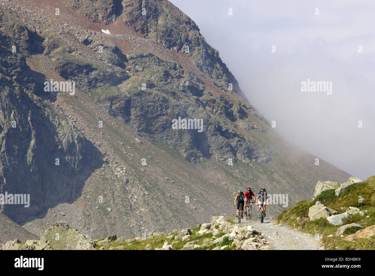 Three Mountainbike riders in the mountains Stock Photo - Alamy
